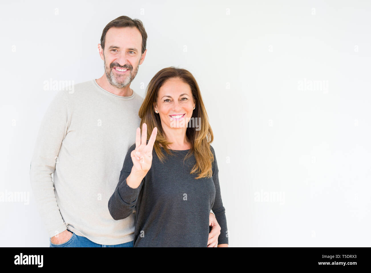 Beautiful middle age couple in love over isolated background showing ...