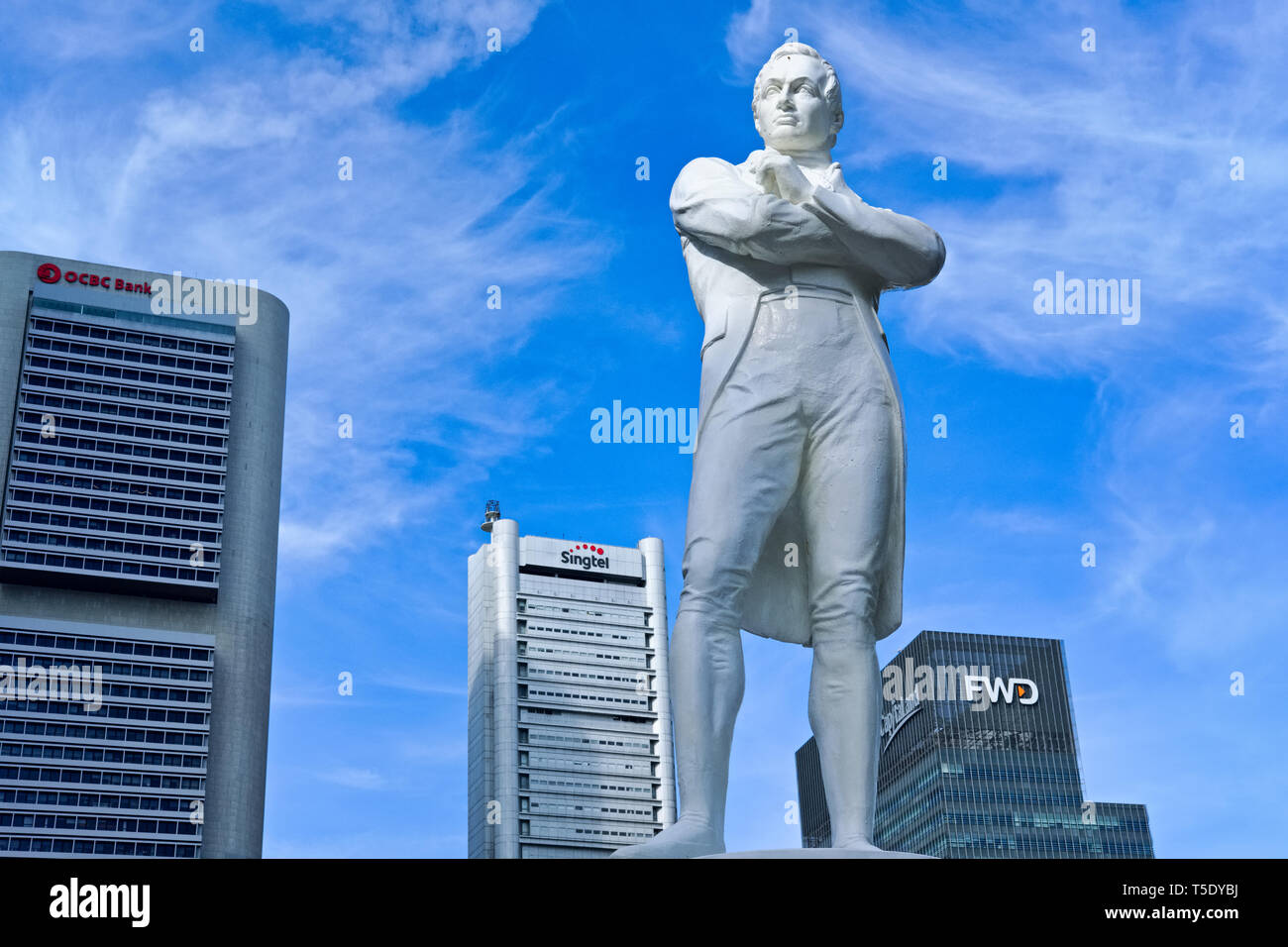 Statue of Sir Stamford Raffles at Raffles' Landing Site by the Singapore River, high rise ...