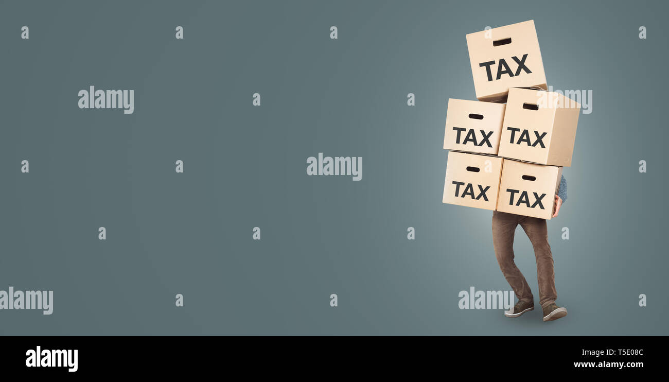 A person carrying a large stack of document storage boxes labeled with ...