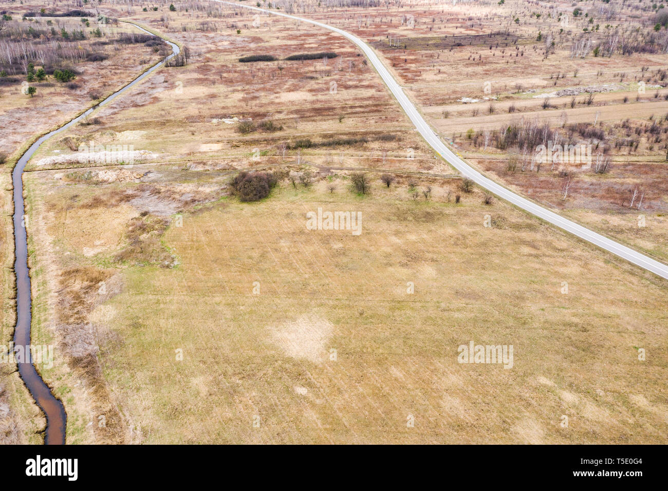 Aerial above view of a rural landscape with a road running. Drone ...