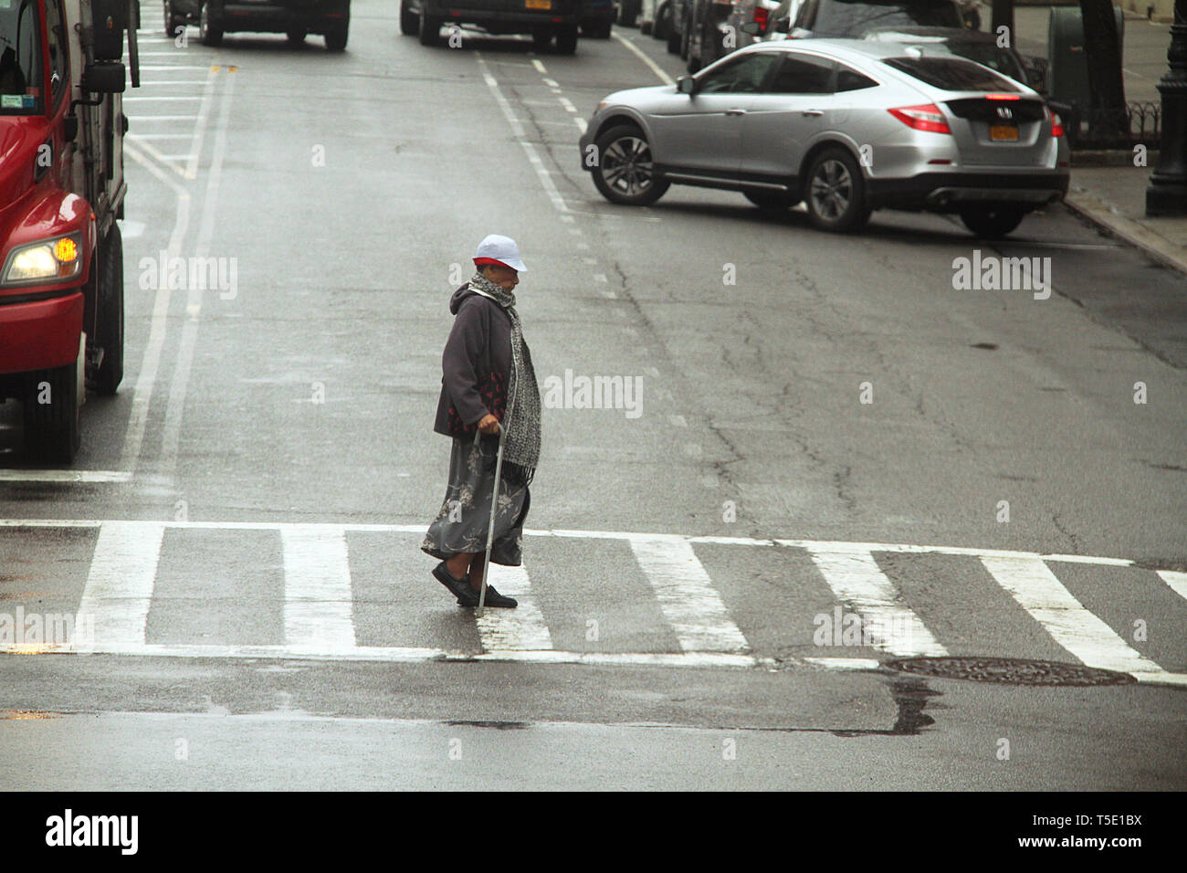 Old lady crossing road hi-res stock photography and images - Alamy