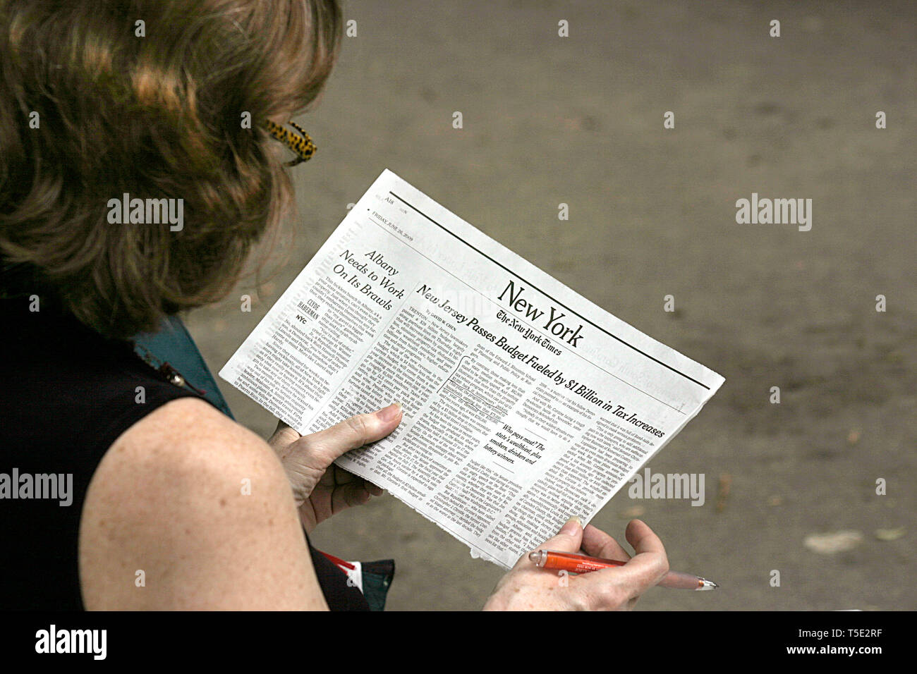 Woman reading times newspaper hi-res stock photography and images - Alamy