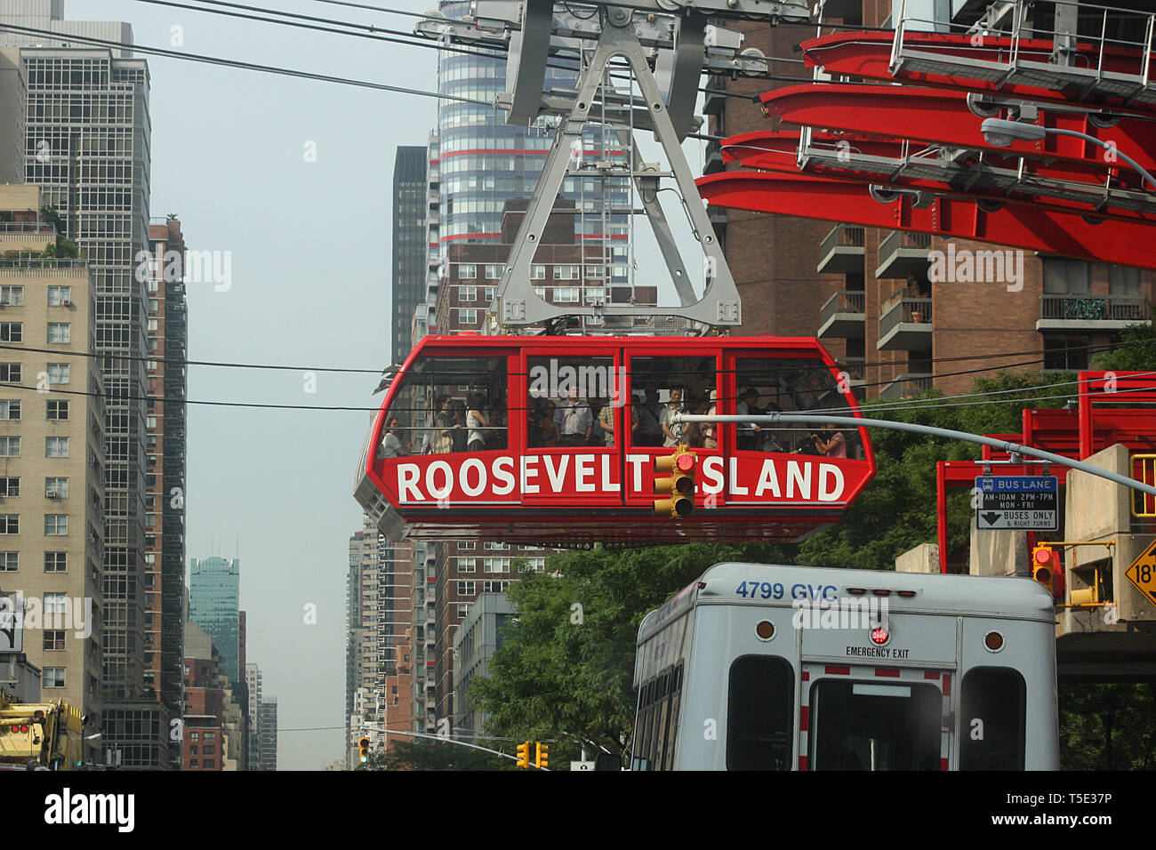 Roosevelt Island Tramway crossing over street in Manhattan, New York ...