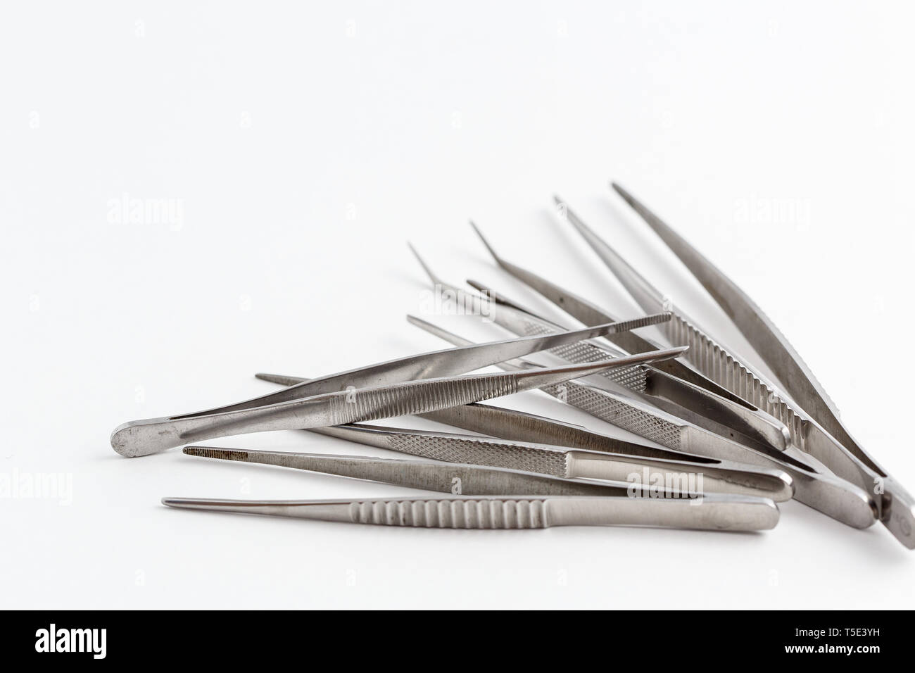surgical instruments on white background Stock Photo - Alamy
