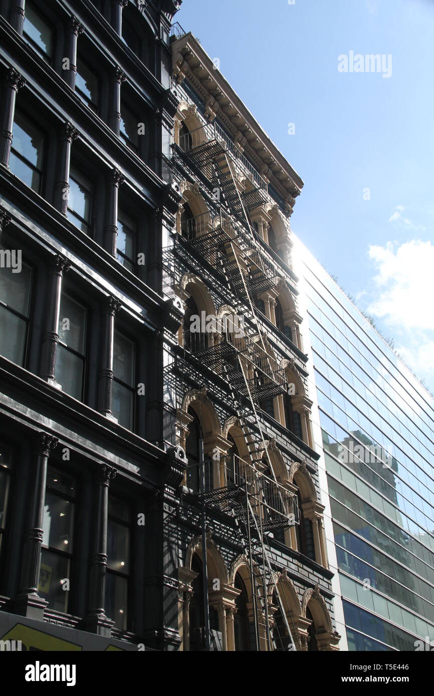 Old buildings' facade near new glass exterior along Broadway in ...