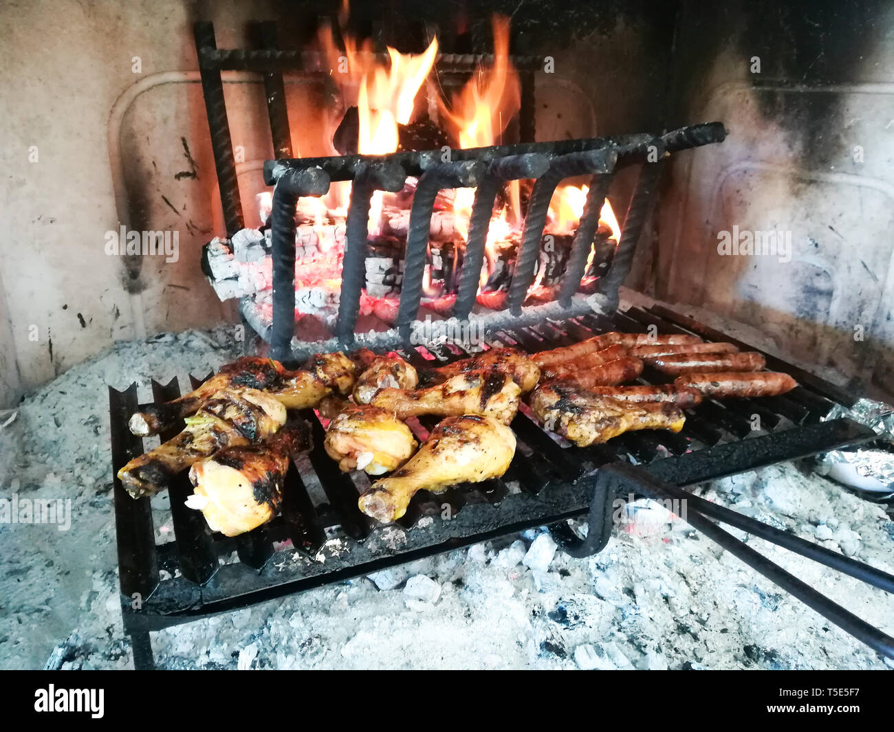 Grilled meat cooked on fireplace Stock Photo - Alamy