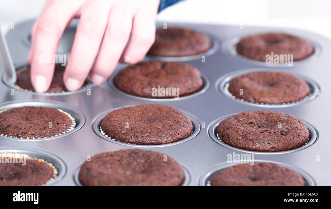 Step by step. Cooling freshly baked chocolate cupcakes on a cooling ...