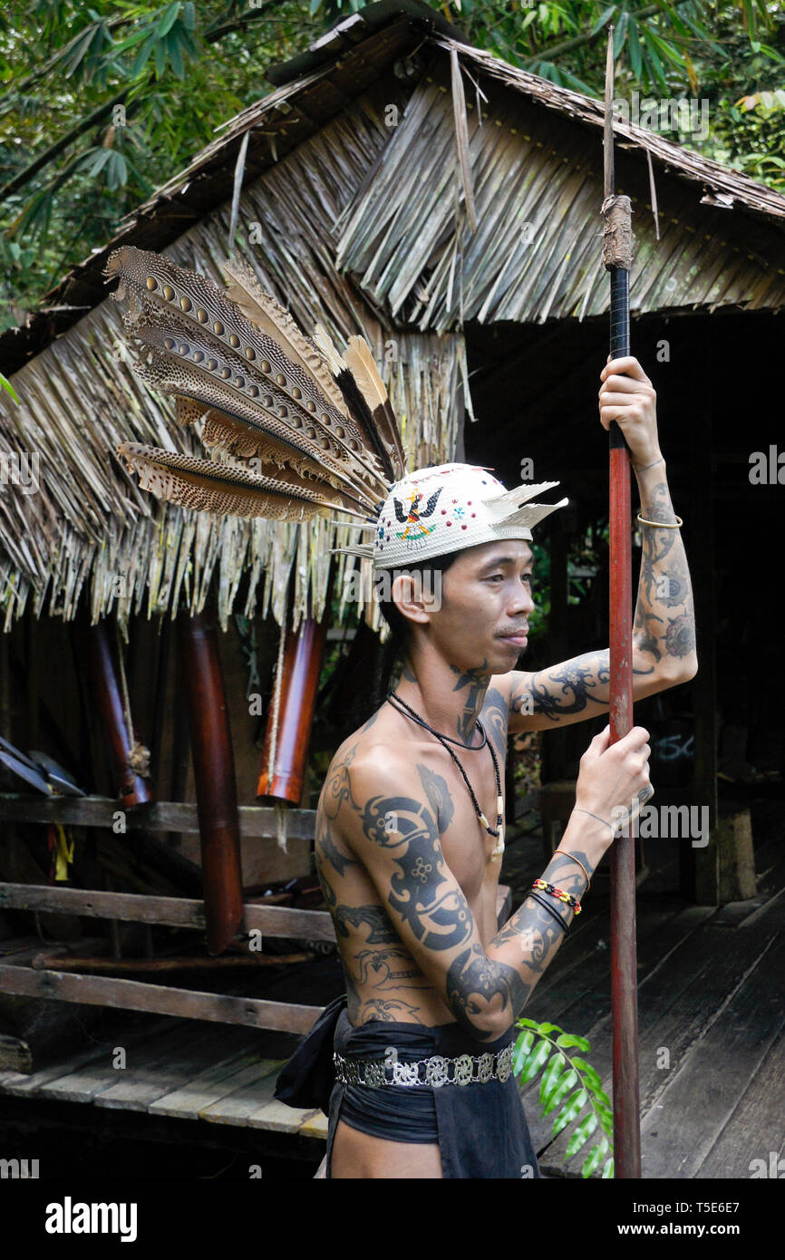 Tattooed Penan tribal man with spear, Sarawak Cultural Village, Kuching ...