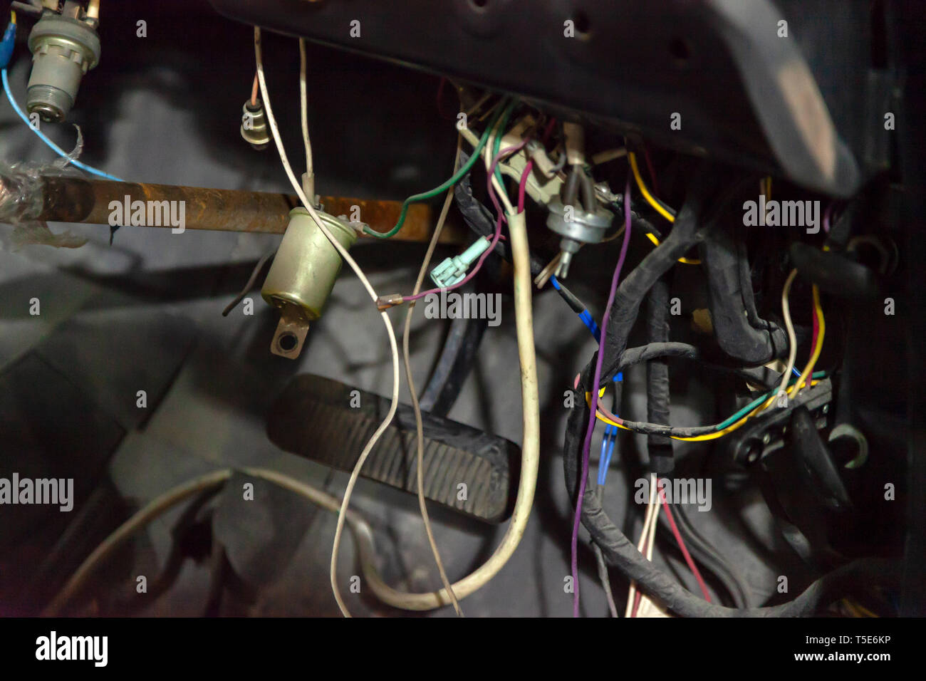 Automotive wiring under the wheel of an old russian retro car, a ...