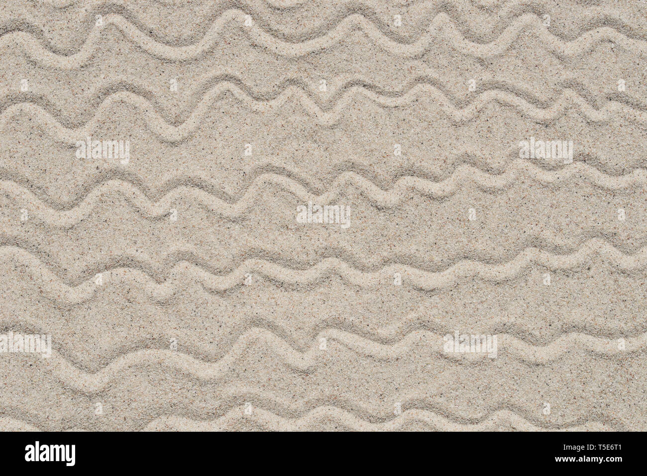 wave pattern on natural sand texture background closeup Stock Photo - Alamy