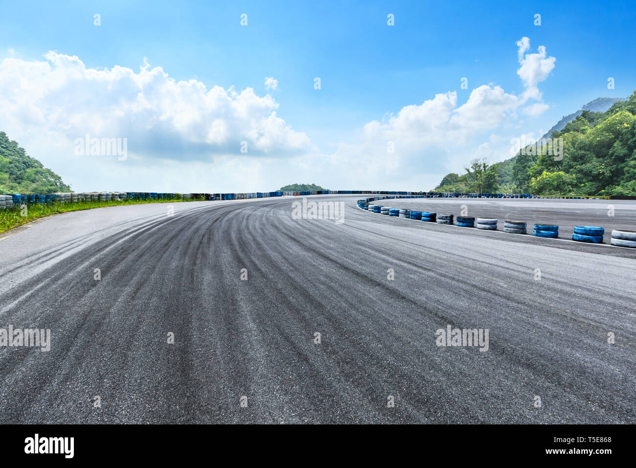 Asphalt race track ground and mountains with blue sky landscape Stock ...
