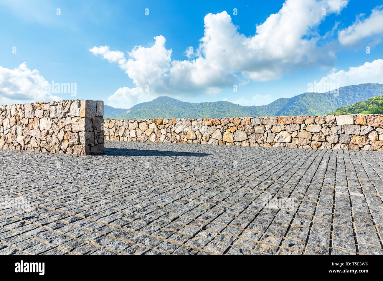 Rough square stone floor and green mountain with sky landscape Stock ...