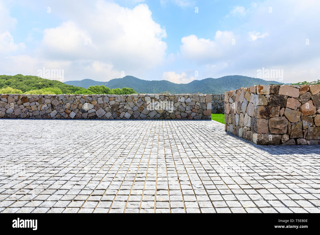 Rough square stone floor and green mountain with sky landscape Stock ...