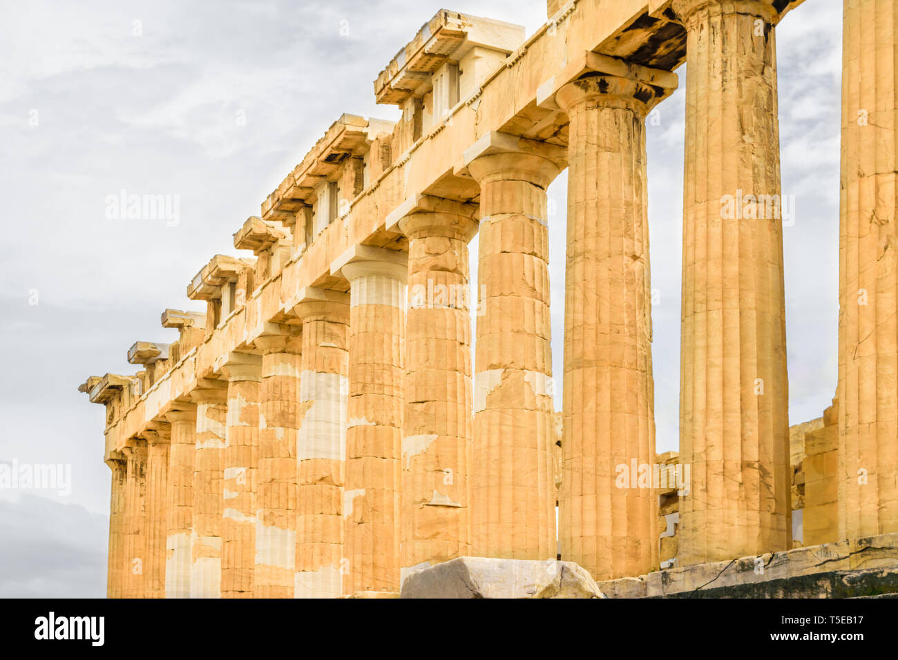 Side view of Parthenon pillars in front of grey and cloudy sky in Athens, Greece Stock Photo - Alamy