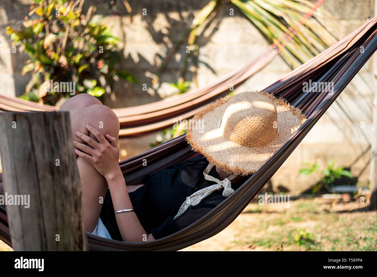 Woman hammock beach hi-res stock photography and images - Alamy