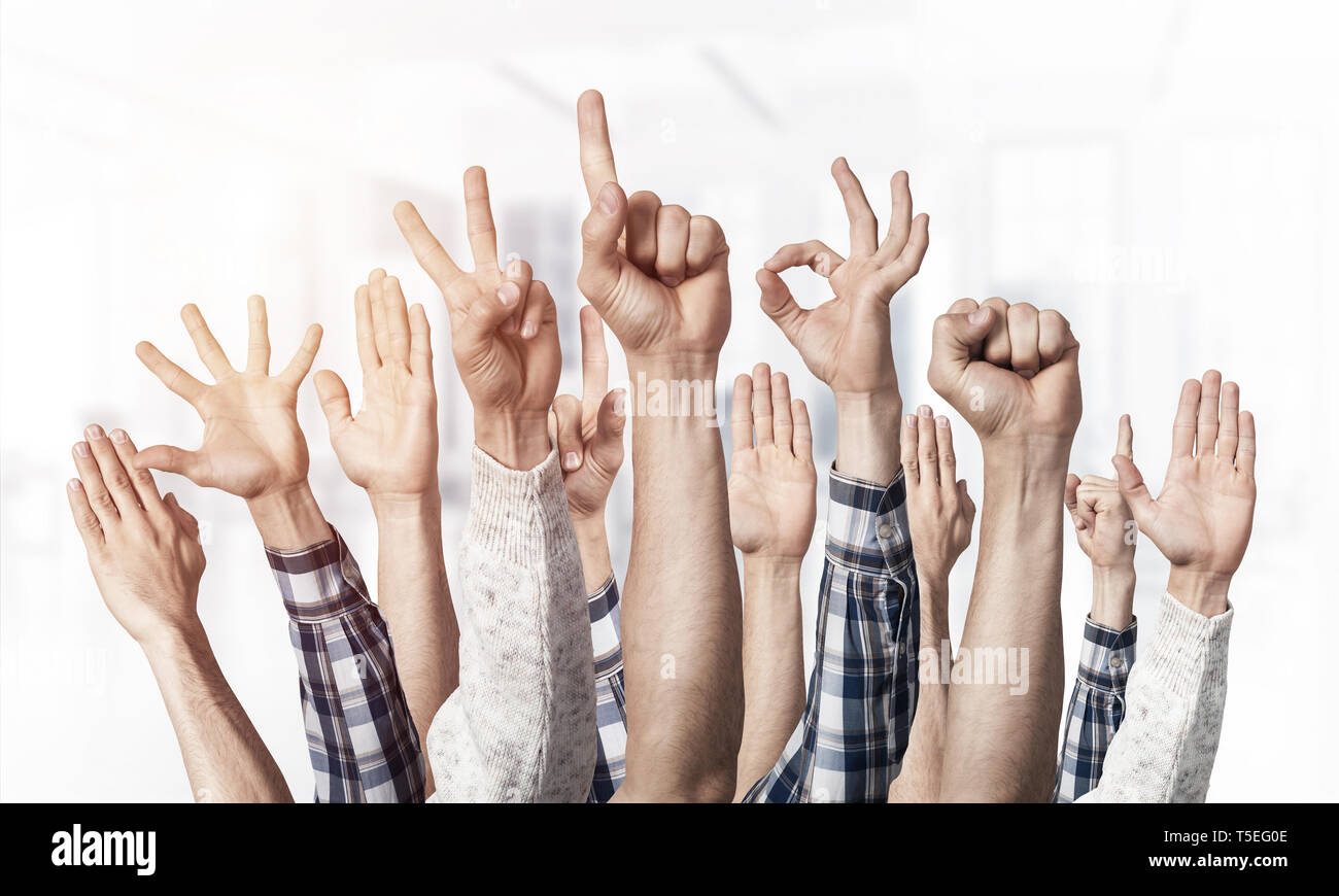 Row raised hands showing different hi-res stock photography and images ...