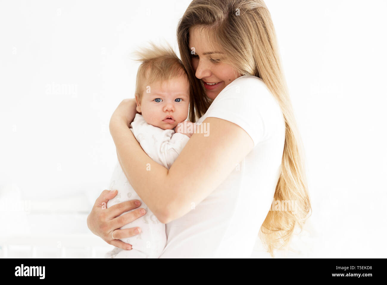 Mom and newborn baby in her arms. The concept of new life, love and ...