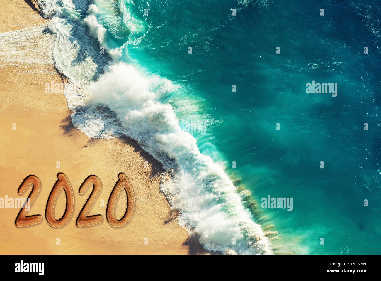 Year 2020 new year greeting text on a beach with turquoise water Stock ...