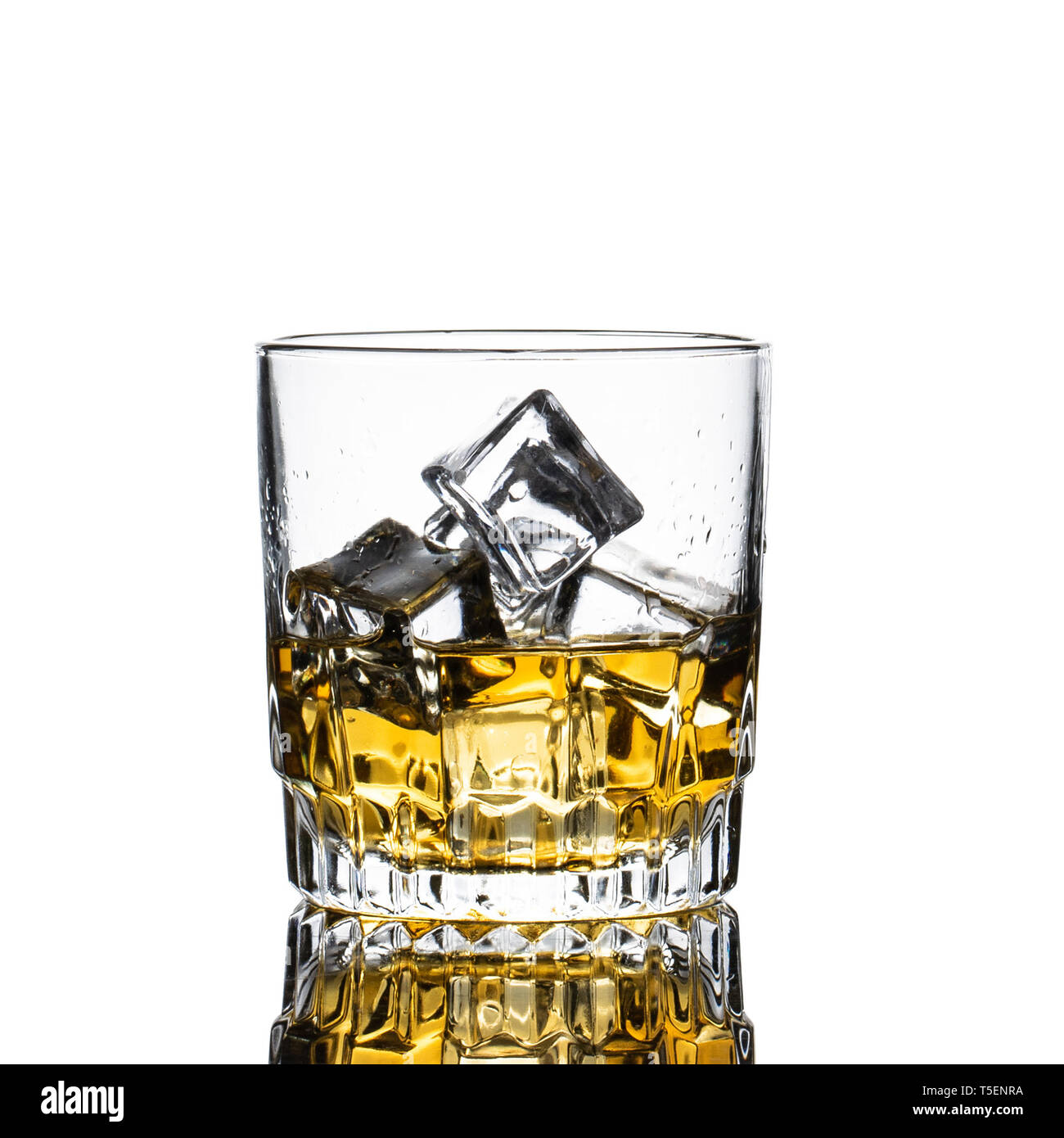 Whiskey Glass closeup, white background, with many ice cubes falling and splashing Stock Photo ...