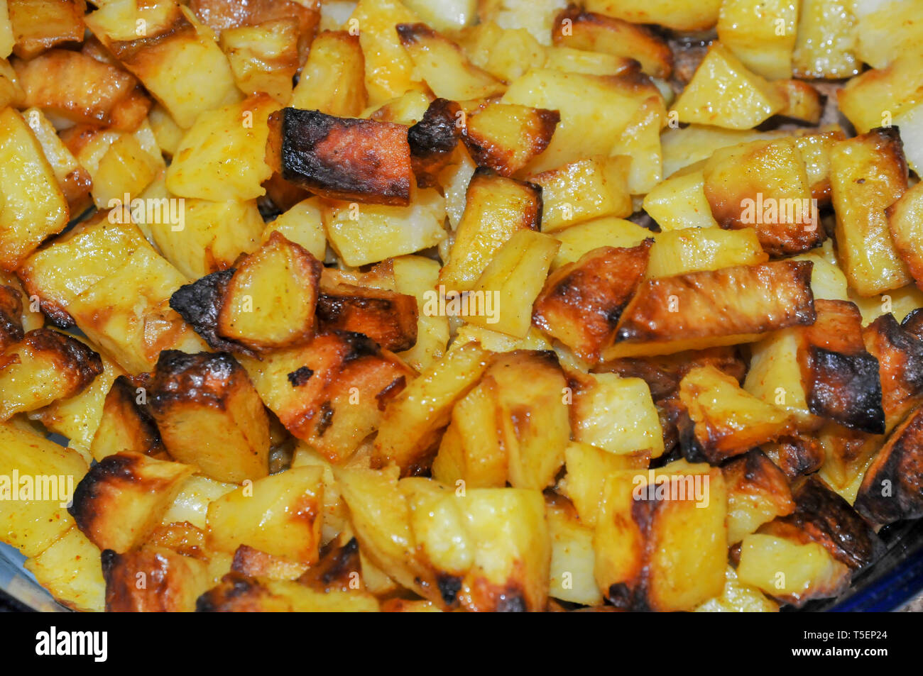 Home cooked meal A bowl of grilled potato squares Stock Photo - Alamy