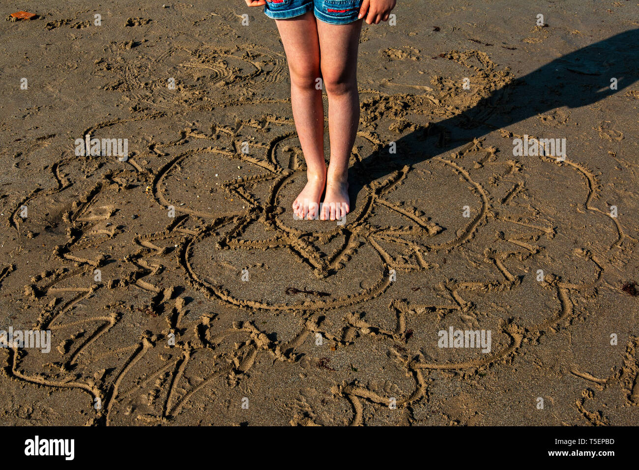 Family drawing in sand hi-res stock photography and images - Alamy