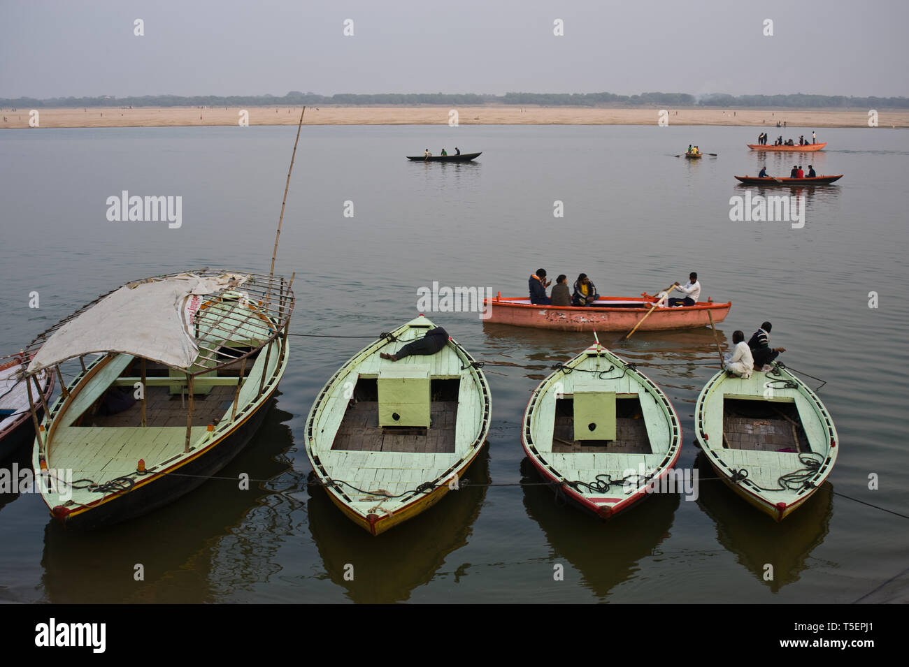 Boats + tourists boating on the Ganges river ( India Stock Photo - Alamy