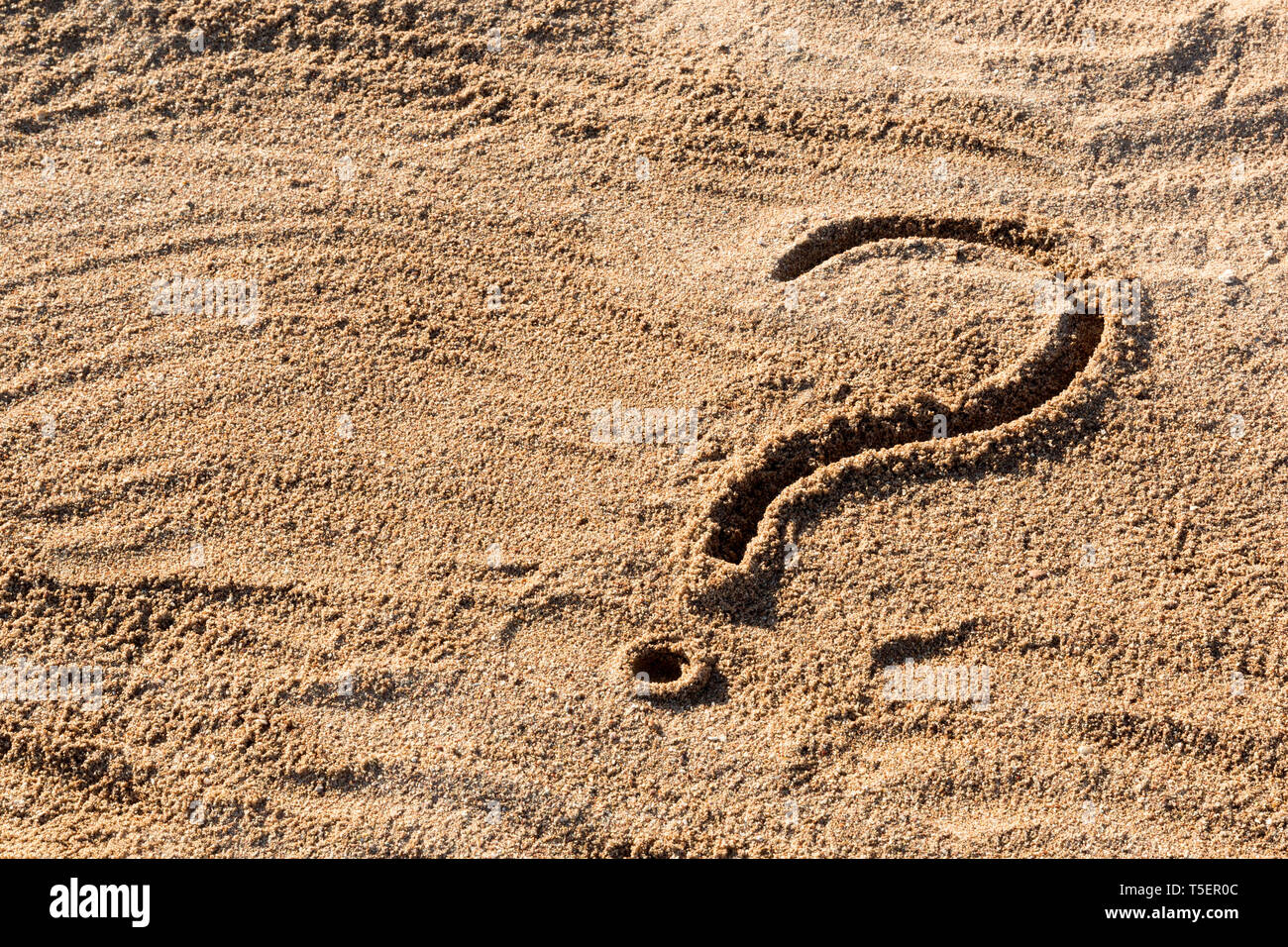 question marks written on beach sand close up, with copy space Stock ...