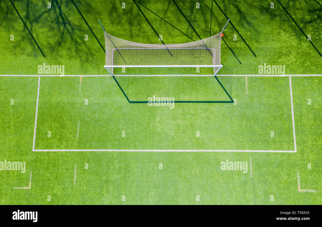 Aerial view of a smal sports soccer football field. Gate from above ...