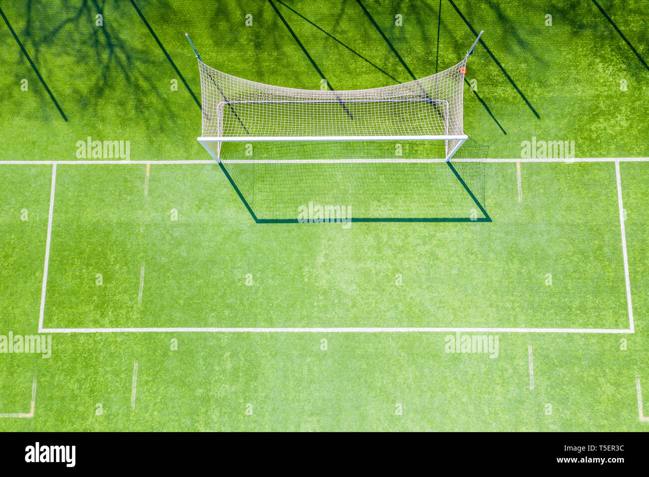 Aerial view of a smal sports soccer football field. Gate from above ...