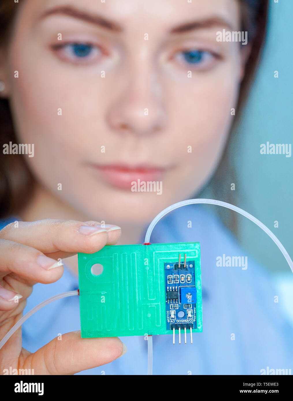 Girl holding polymers Bio-MEMS biomedical microelectromechanical ...