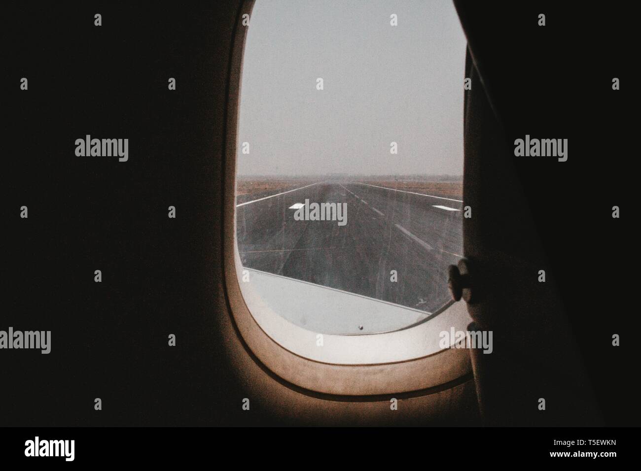 An airplane runway shot from an airplane window Stock Photo - Alamy