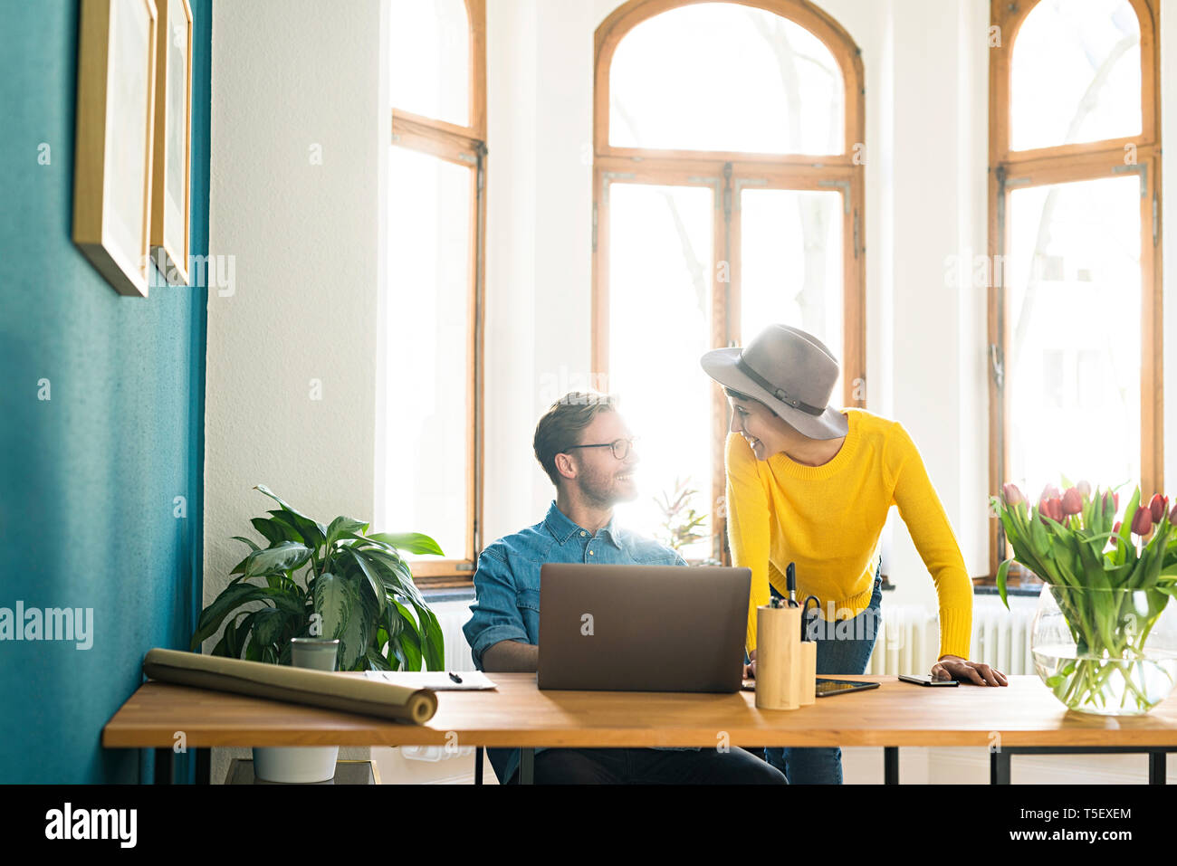 Working couple at the office hi-res stock photography and images - Alamy