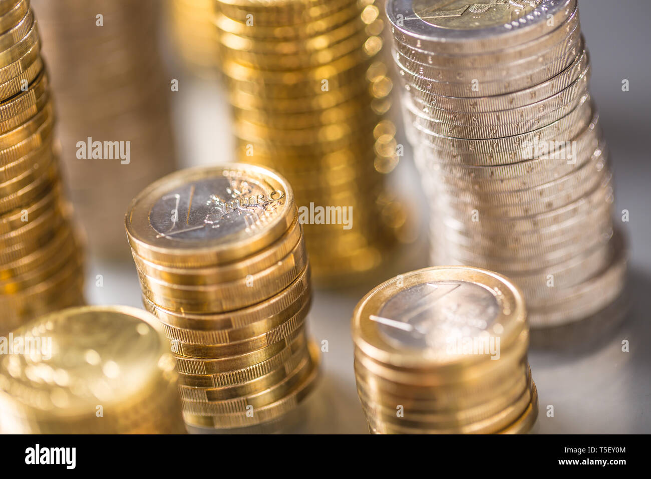 Towers of the euro coins stacked in different positions Stock Photo - Alamy