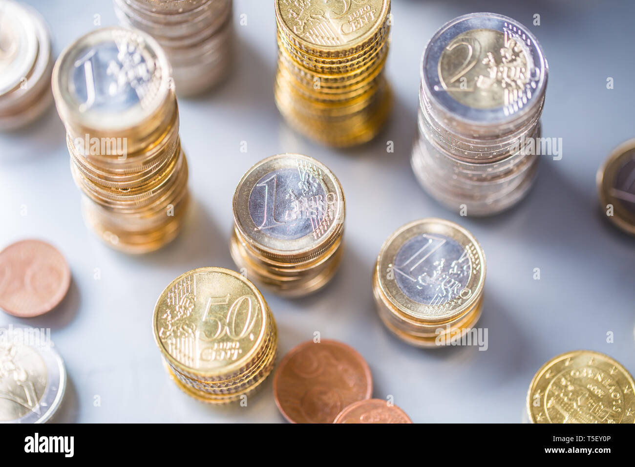 Towers of the euro coins stacked in different positions Stock Photo - Alamy