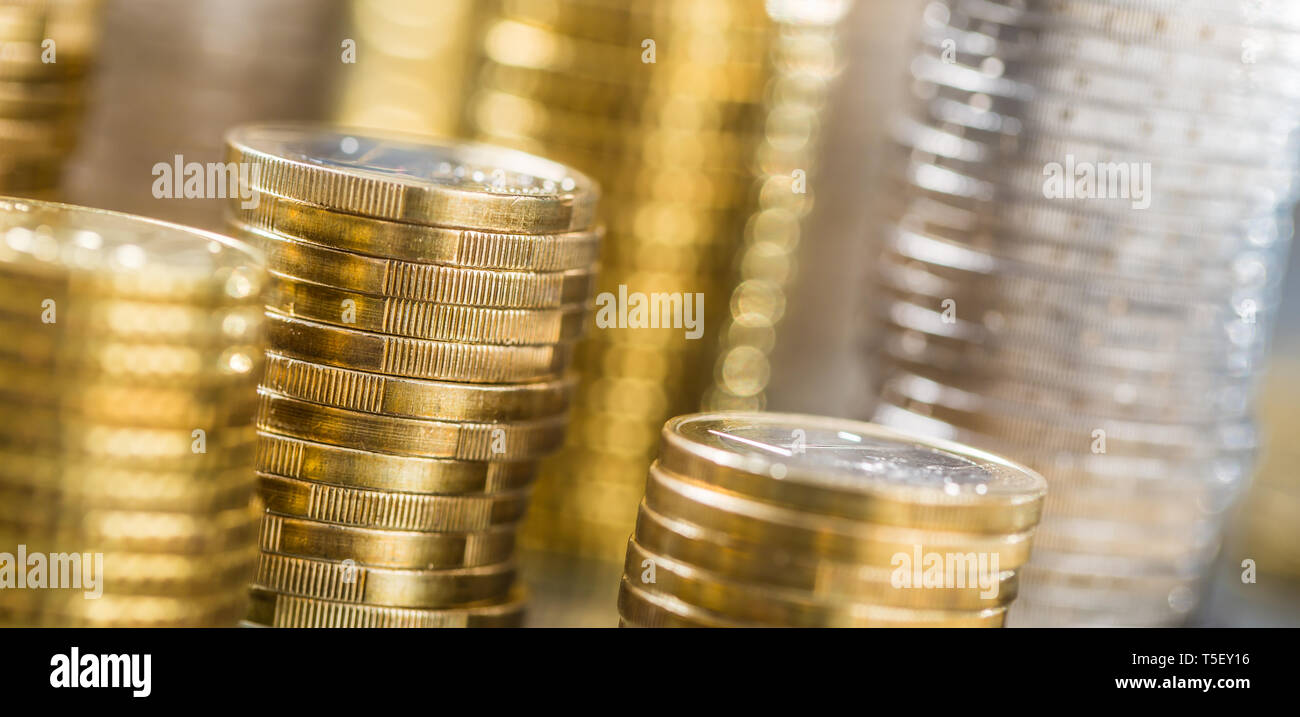 Towers of the euro coins stacked in different positions Stock Photo - Alamy