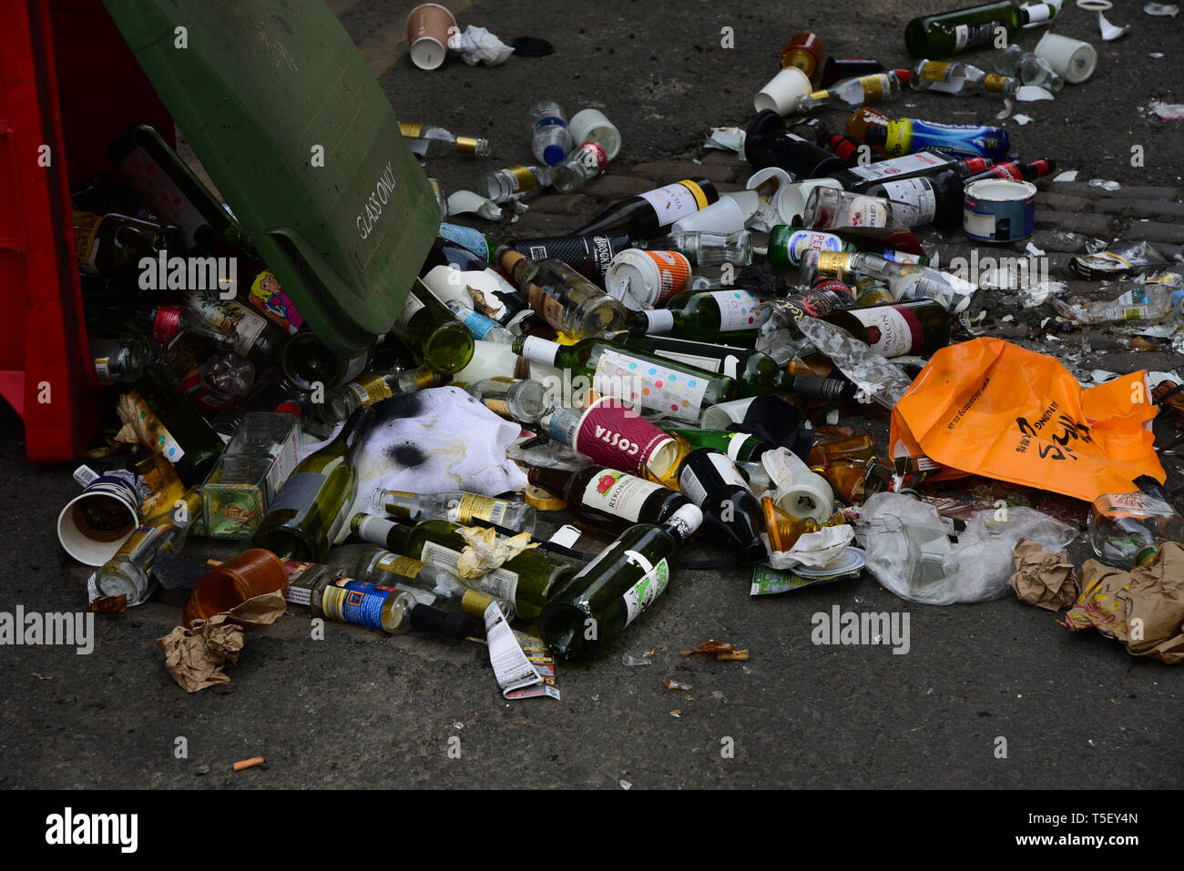empty bottles spill out of knocked over bin Stock Photo - Alamy