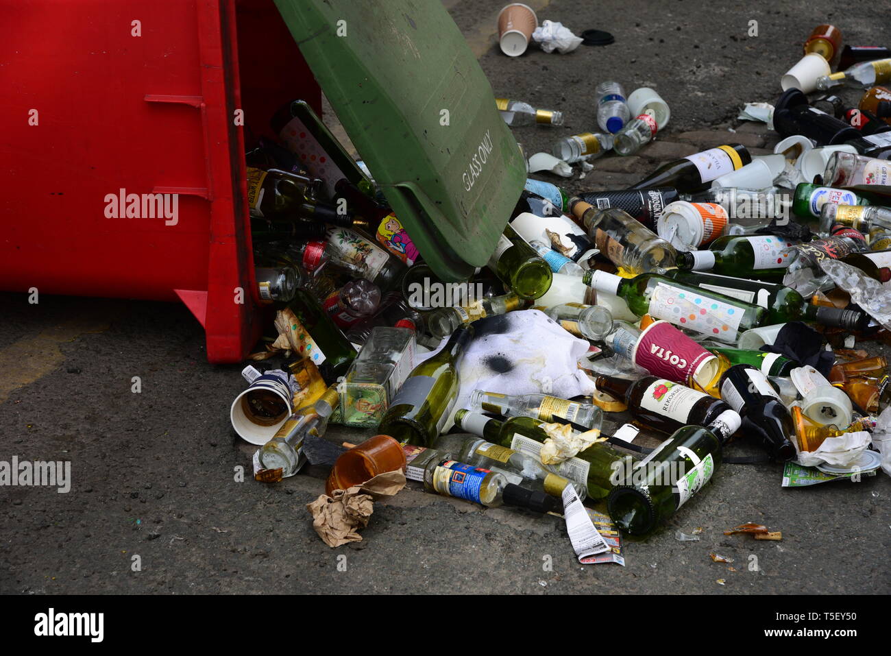 empty bottles spill out of knocked over bin Stock Photo - Alamy