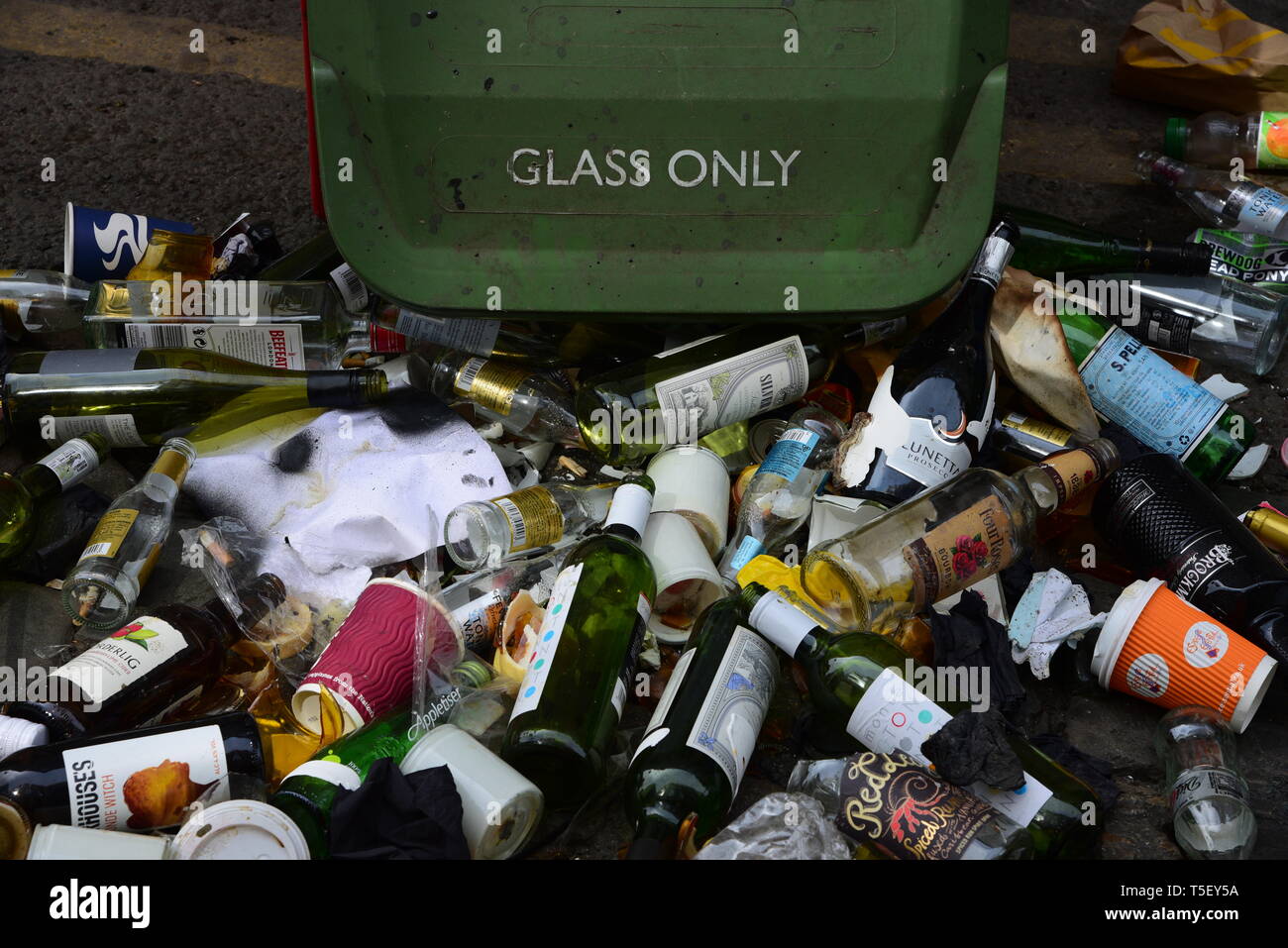 empty bottles spill out of knocked over bin Stock Photo - Alamy