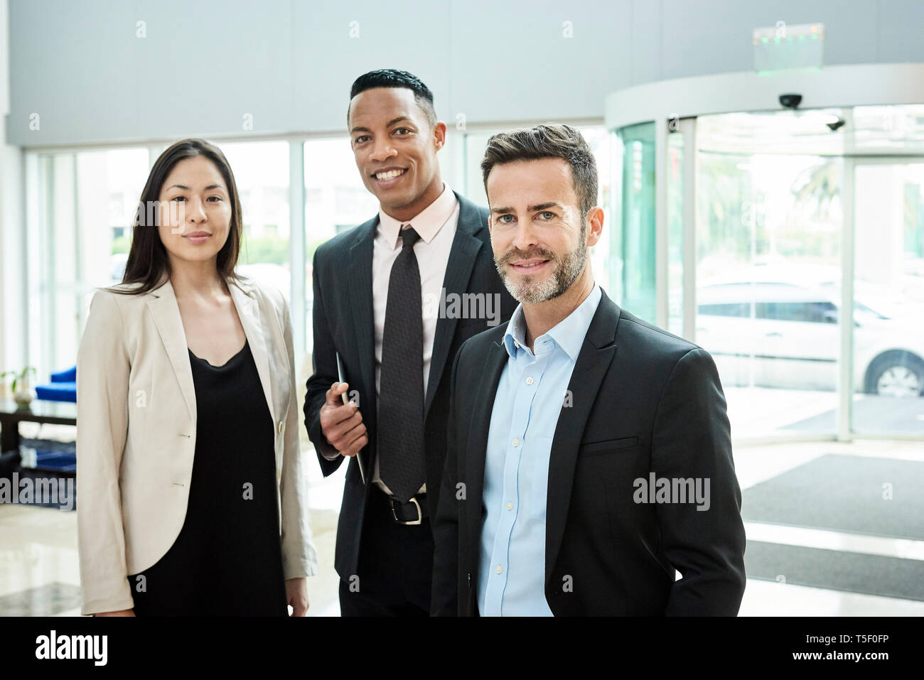 Business people standing hotel lobby hi-res stock photography and ...