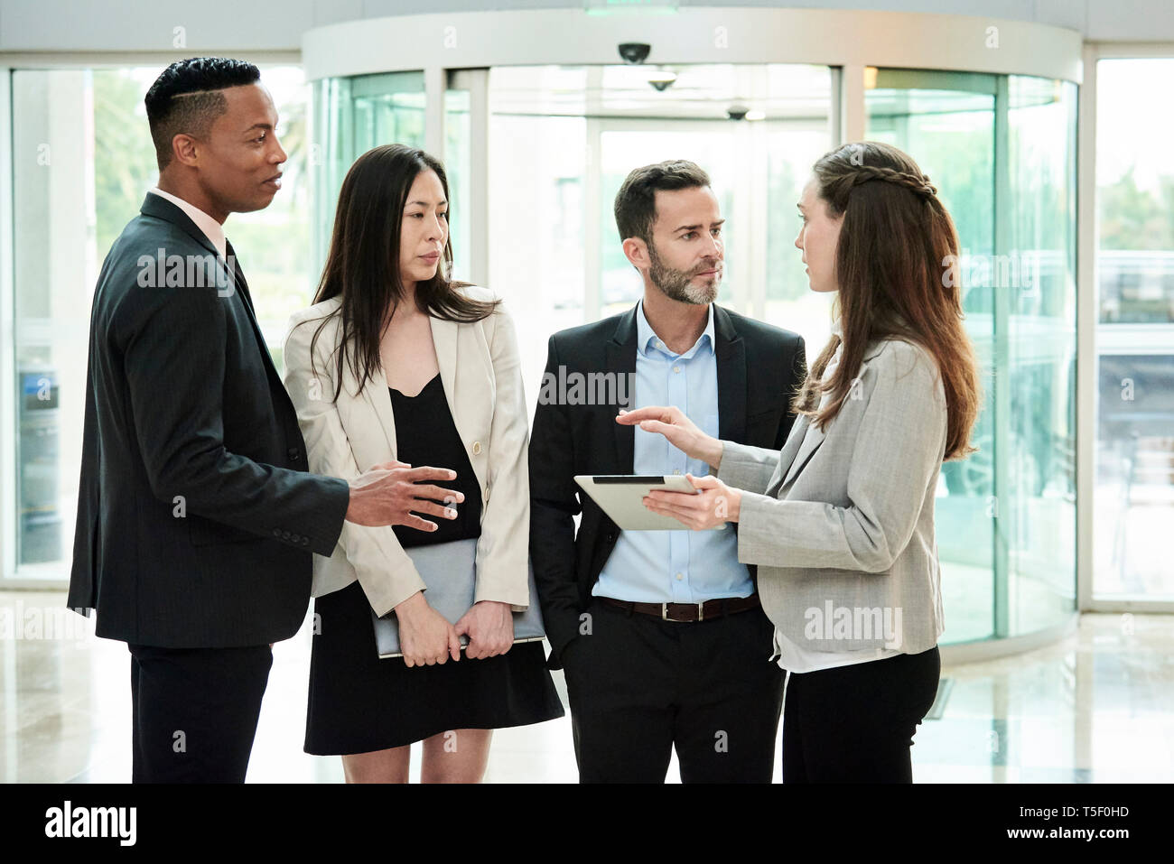 Standing communication explaining technology hi-res stock photography ...