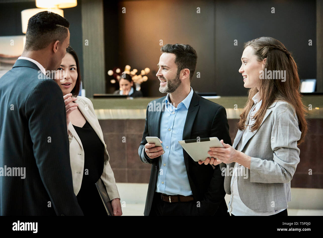 Colleague standing discussion hi-res stock photography and images - Alamy