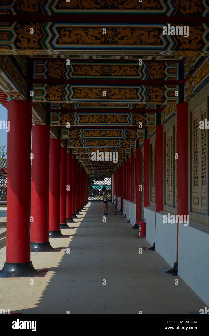 Exterior corridor of red columns at the Confucius Chinese temple ...