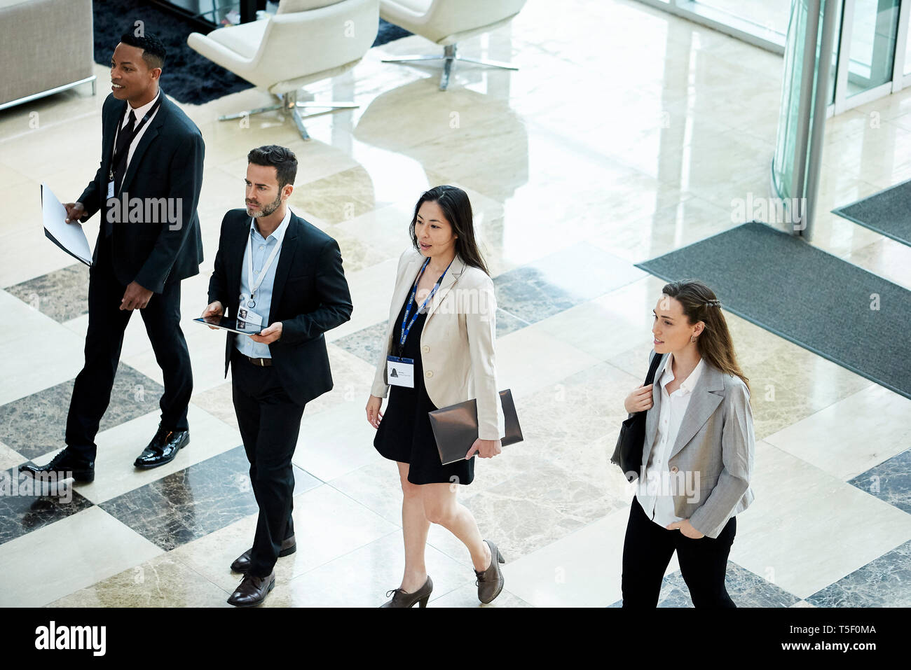 Business people walking in hotel lobby Stock Photo - Alamy