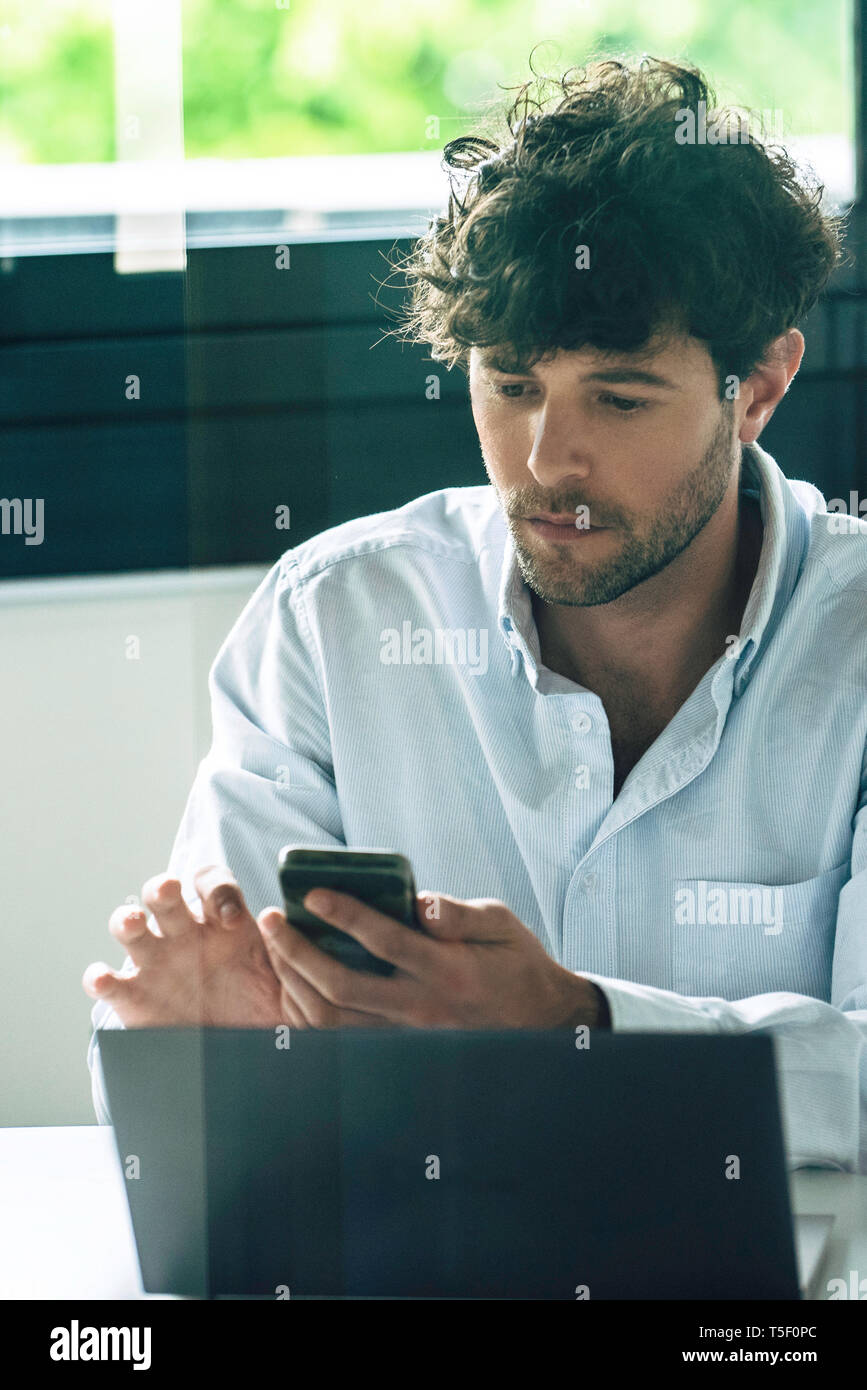Businessman using smartphone and laptop hi-res stock photography and ...