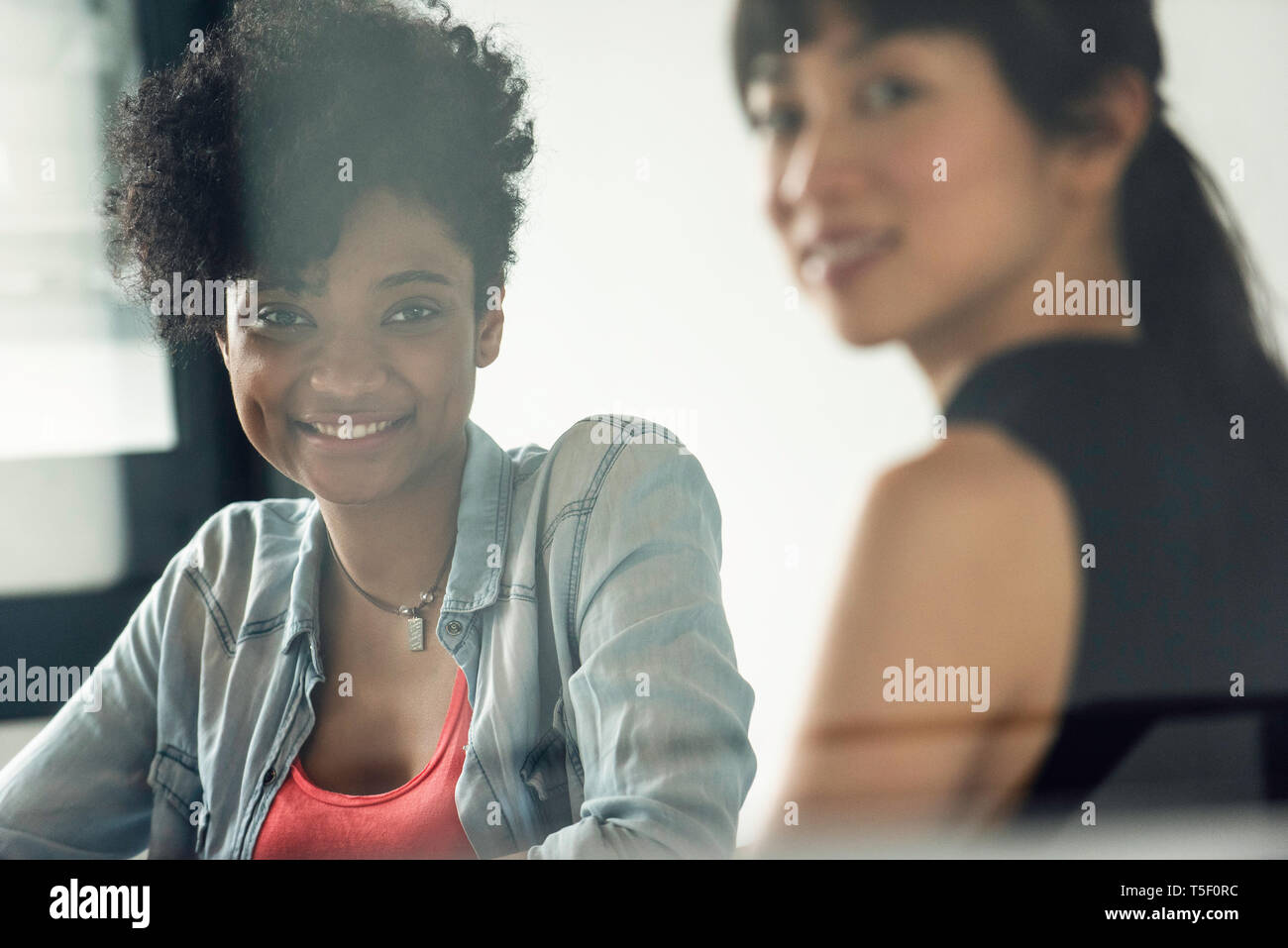 Sitting smiling happiness confidence hi-res stock photography and ...