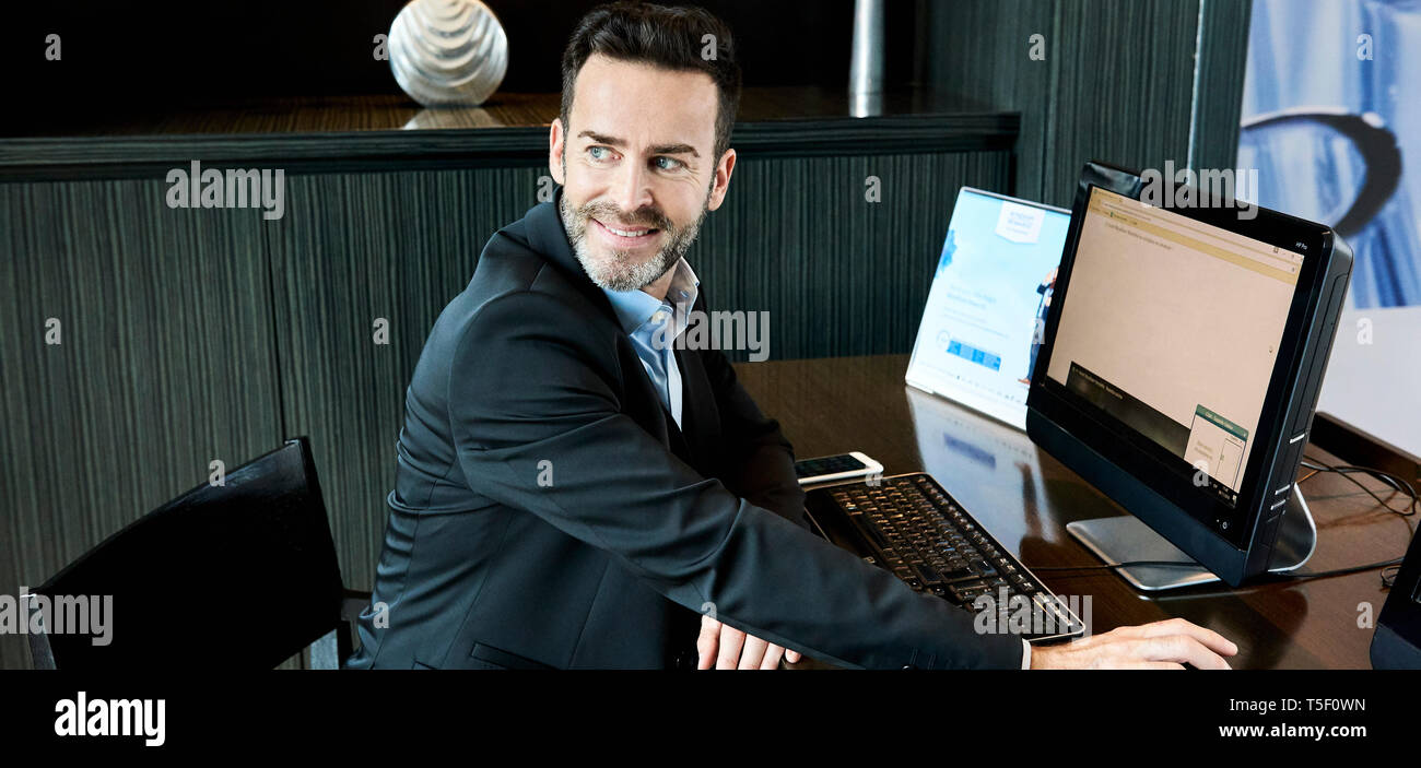 Working desktop computer using keyboard hi-res stock photography and ...