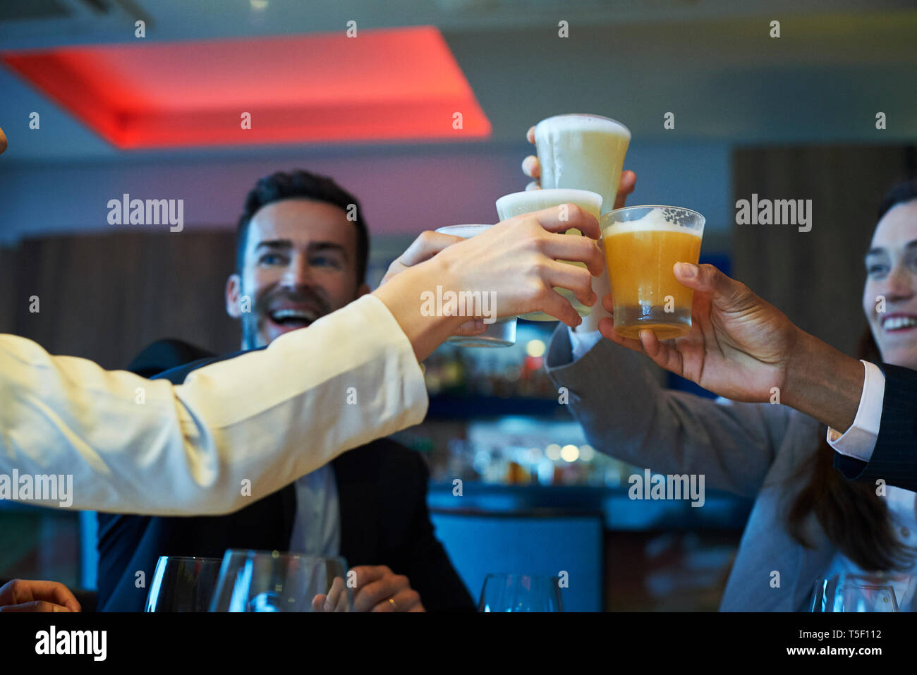 Business people toasting drink at bar Stock Photo - Alamy