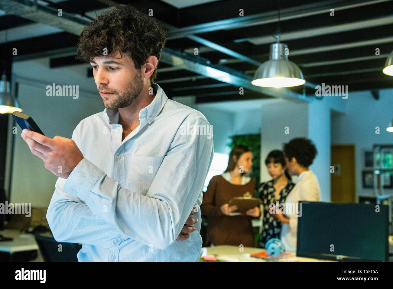 Serious businessman using mobile hi-res stock photography and images ...