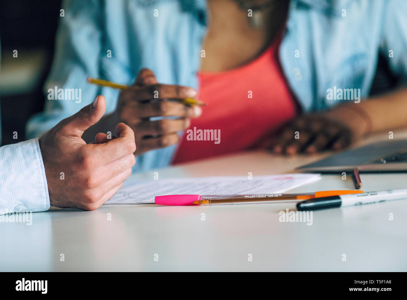 Hand holding colour in office hi-res stock photography and images - Alamy