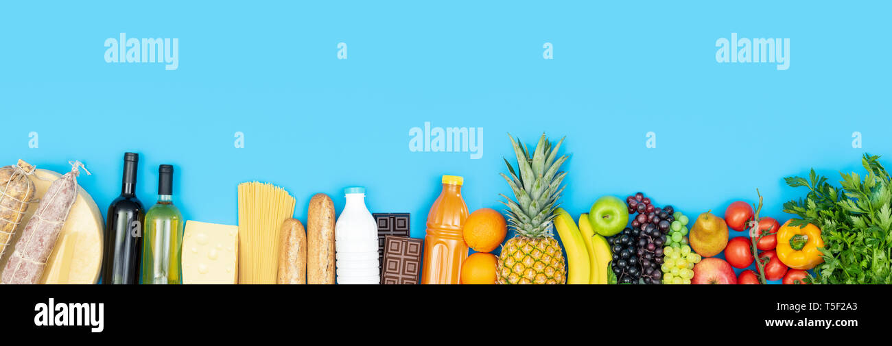 Fresh healthy grocery shopping items: vegetables, fruit, drinks, dairy ...